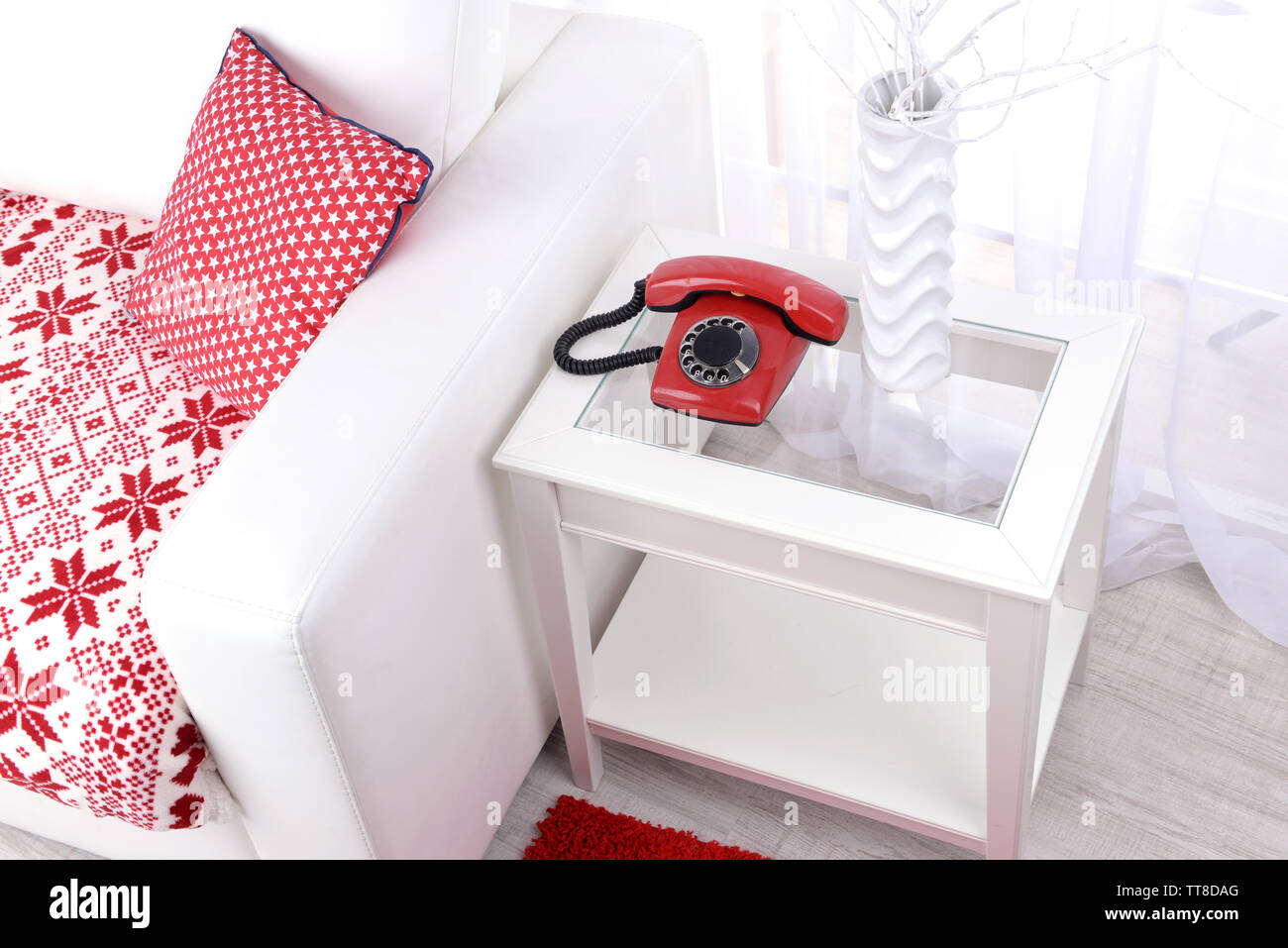 Retro phone on nightstand in room Stock Photo - Alamy