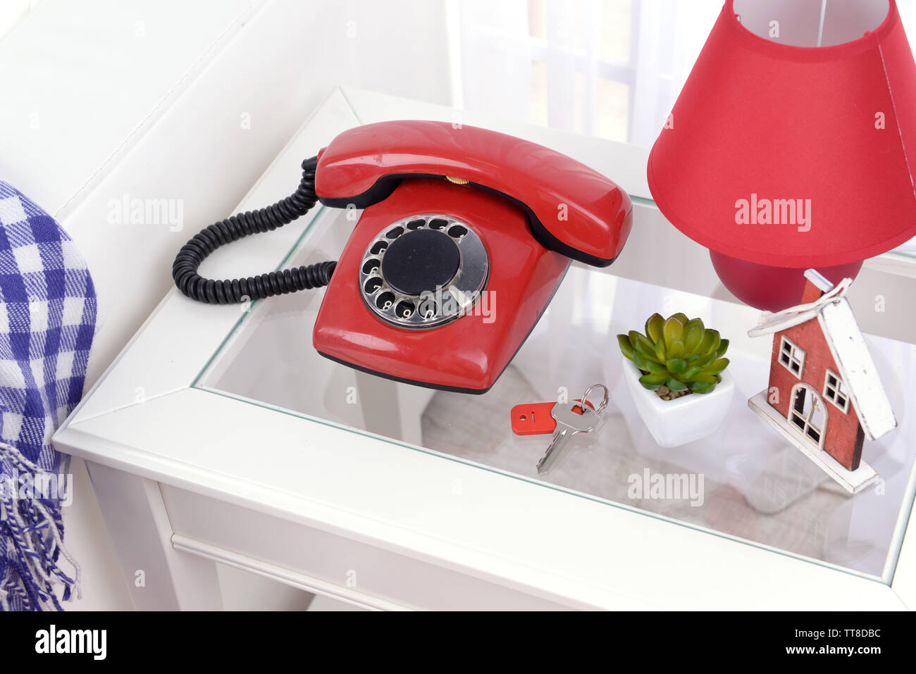 Retro phone on nightstand in room Stock Photo - Alamy