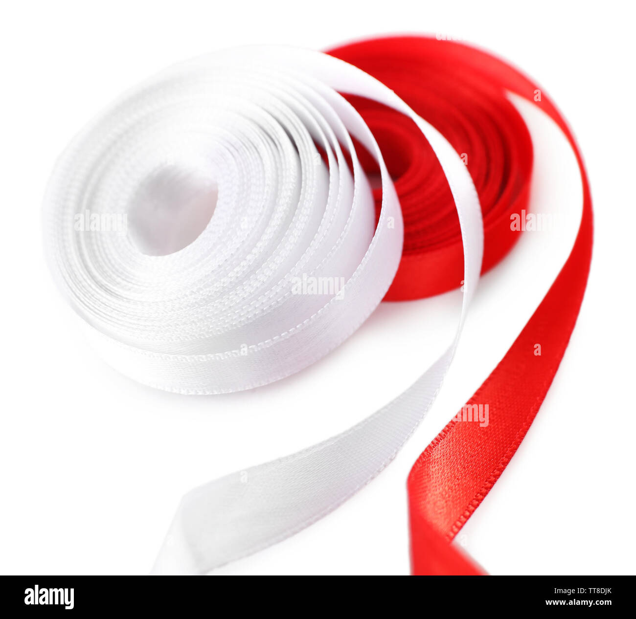 Colorful red and white ribbons isolated on white Stock Photo - Alamy
