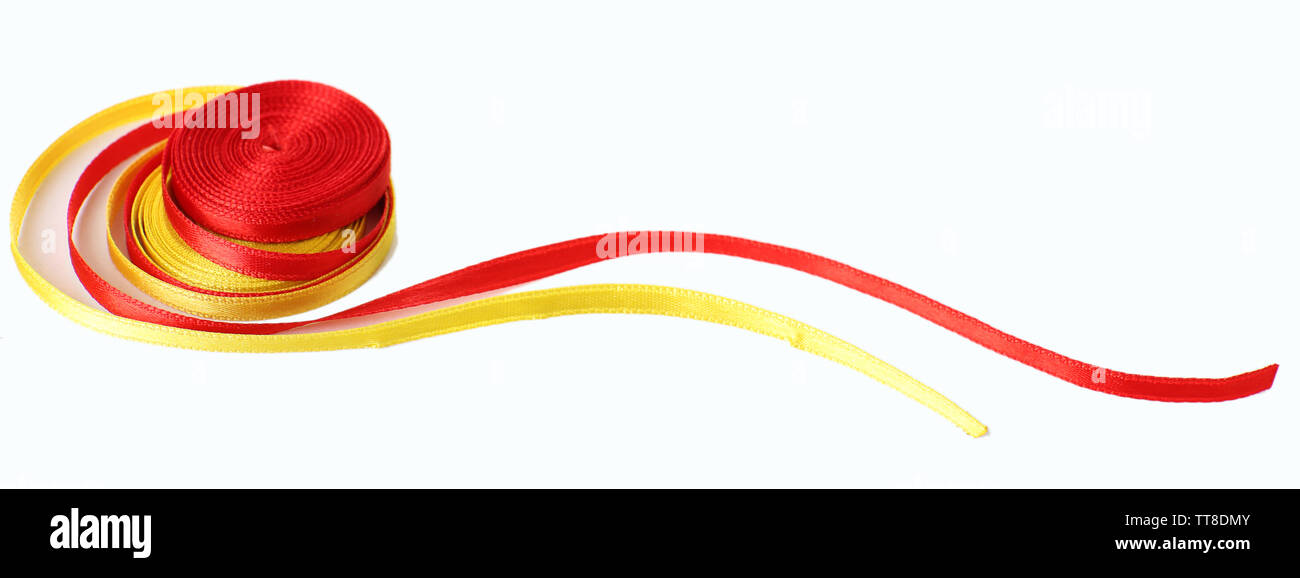 Colorful red and yellow ribbons isolated on white Stock Photo - Alamy