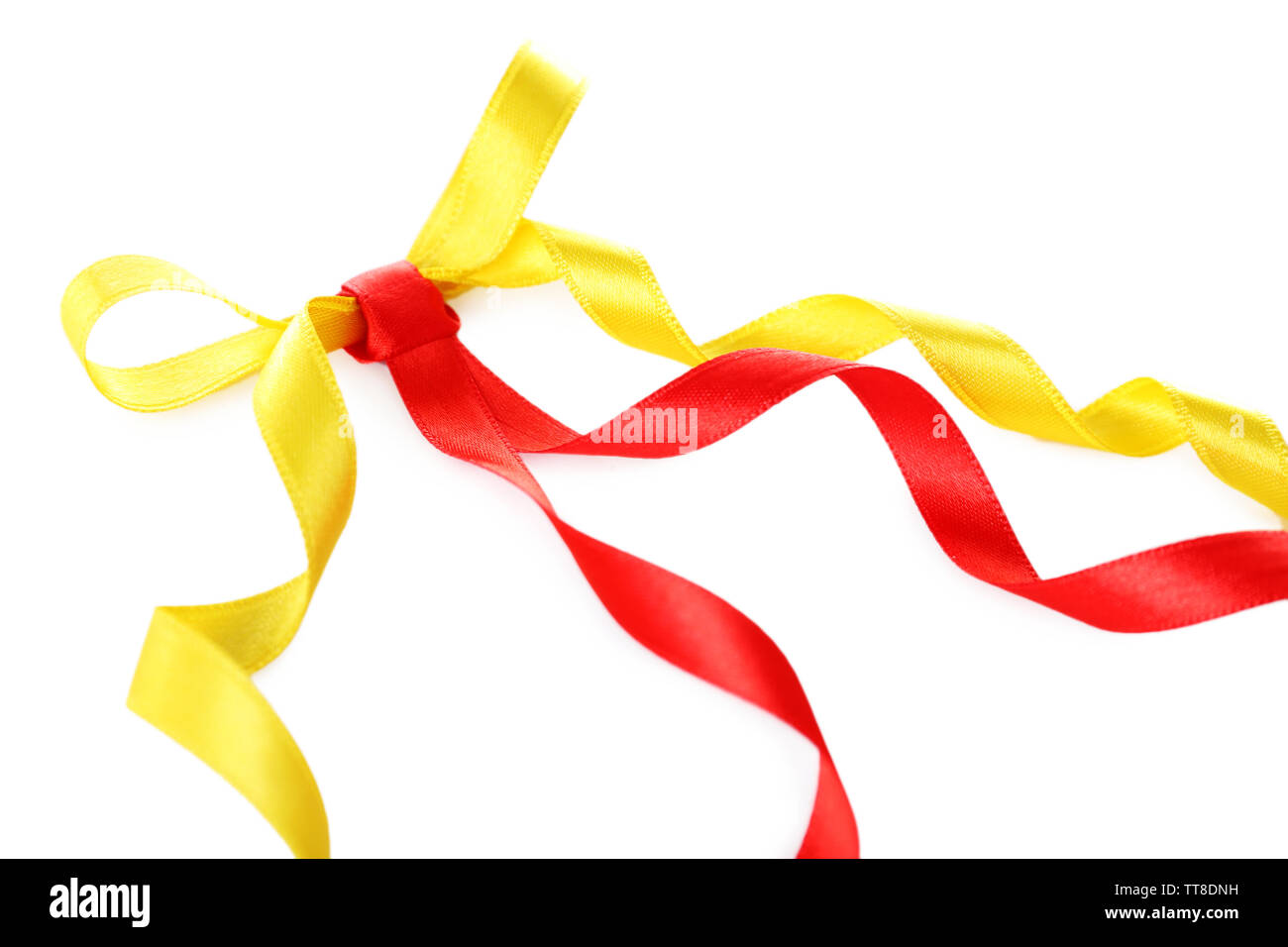 Colorful red and yellow ribbons with bow isolated on white Stock Photo ...