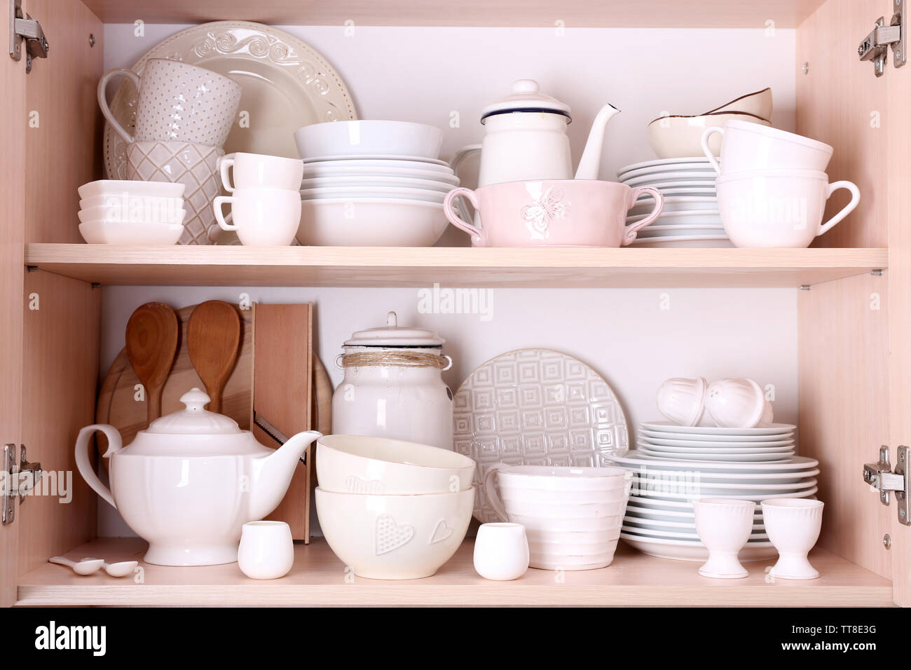 Kitchen utensils and tableware on wooden shelves Stock Photo - Alamy