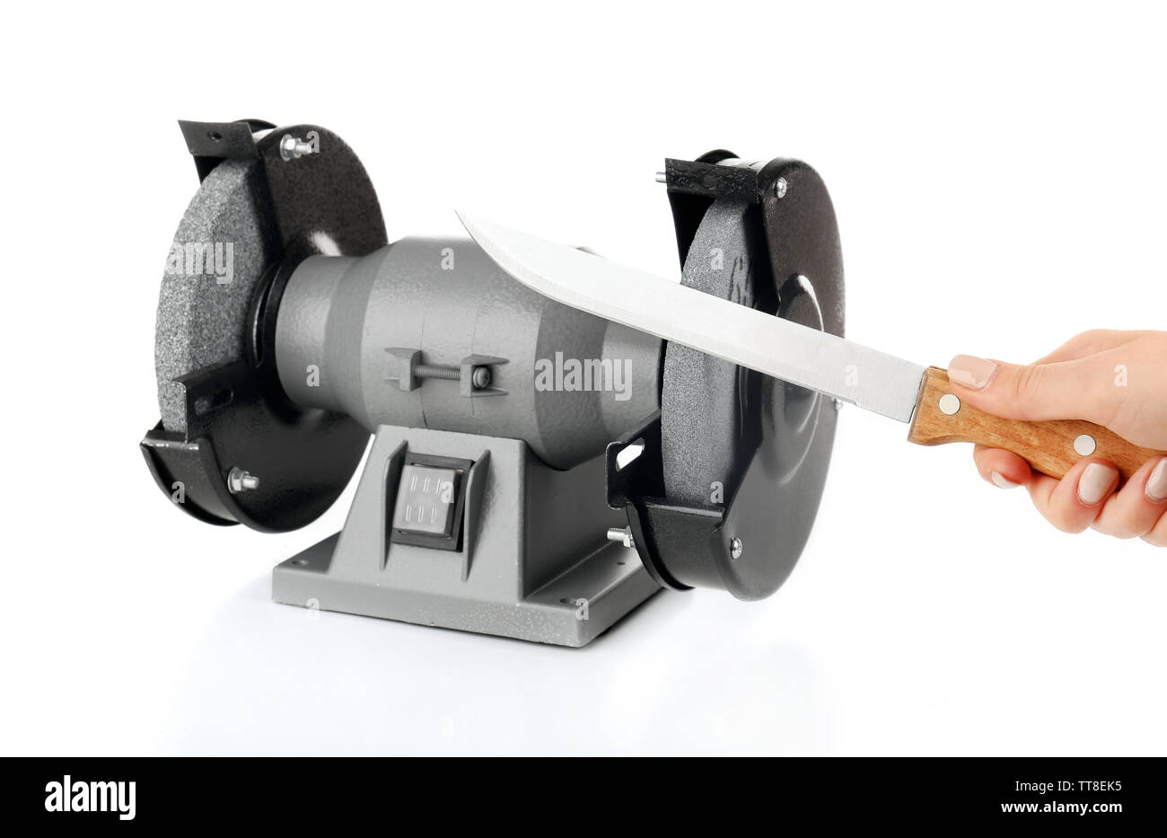 Sharpening knife process isolated on white Stock Photo - Alamy