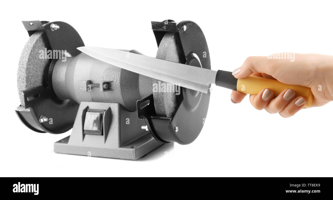 Sharpening knife process isolated on white Stock Photo - Alamy