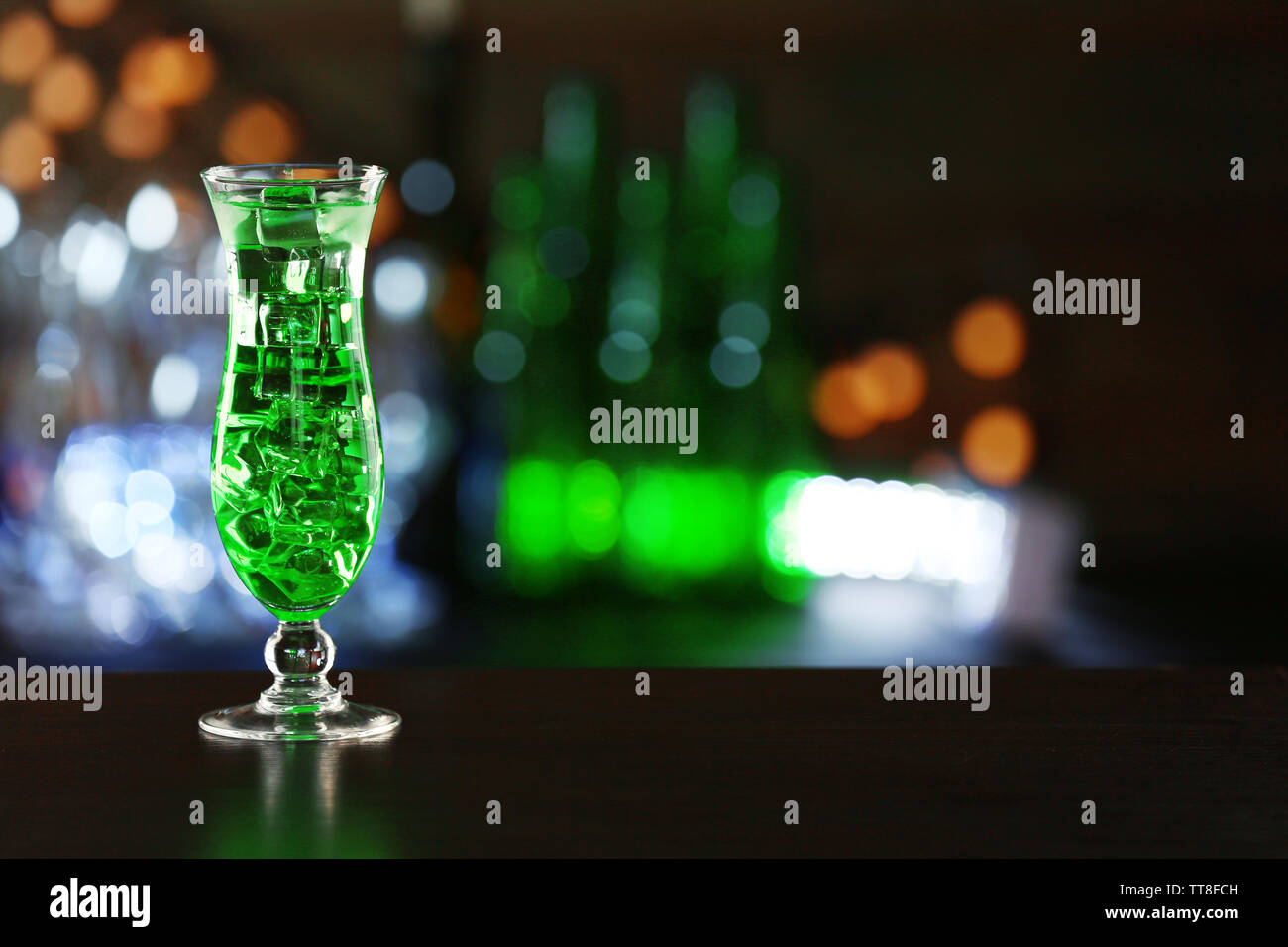 Green cocktail on table on dark background Stock Photo - Alamy