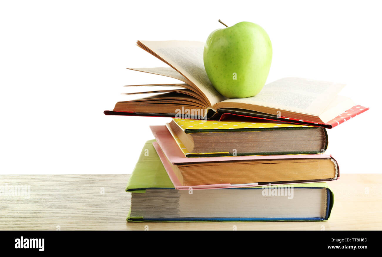 Books and apple on desk, isolated on white Stock Photo - Alamy