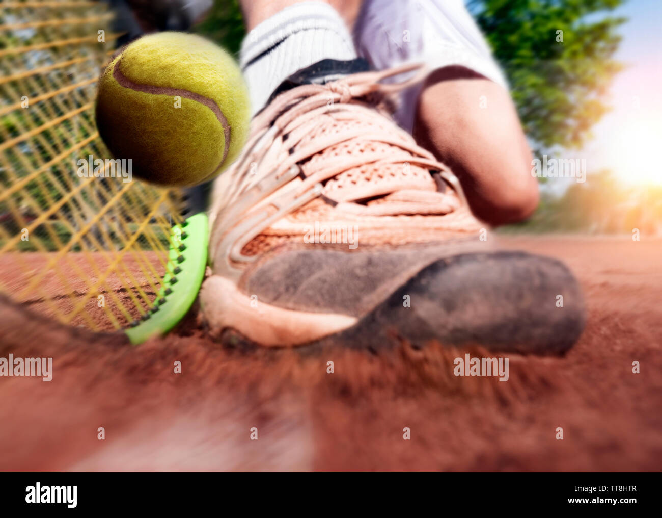 Tennis player on clay tennis court Stock Photo - Alamy