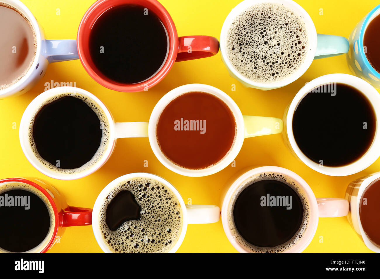 Many cups of coffee on color table, top view Stock Photo - Alamy