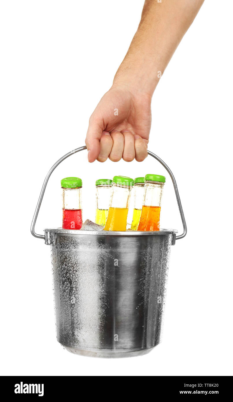 Female hand with metal bucket of alcoholic cocktails isolated on white ...