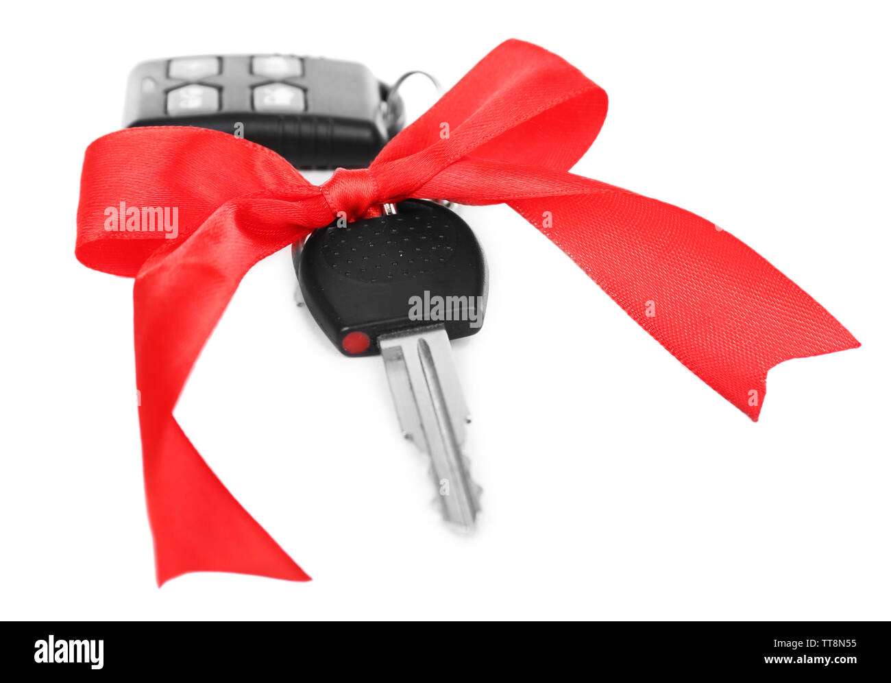 Car keys with red bow as present isolated on white Stock Photo - Alamy