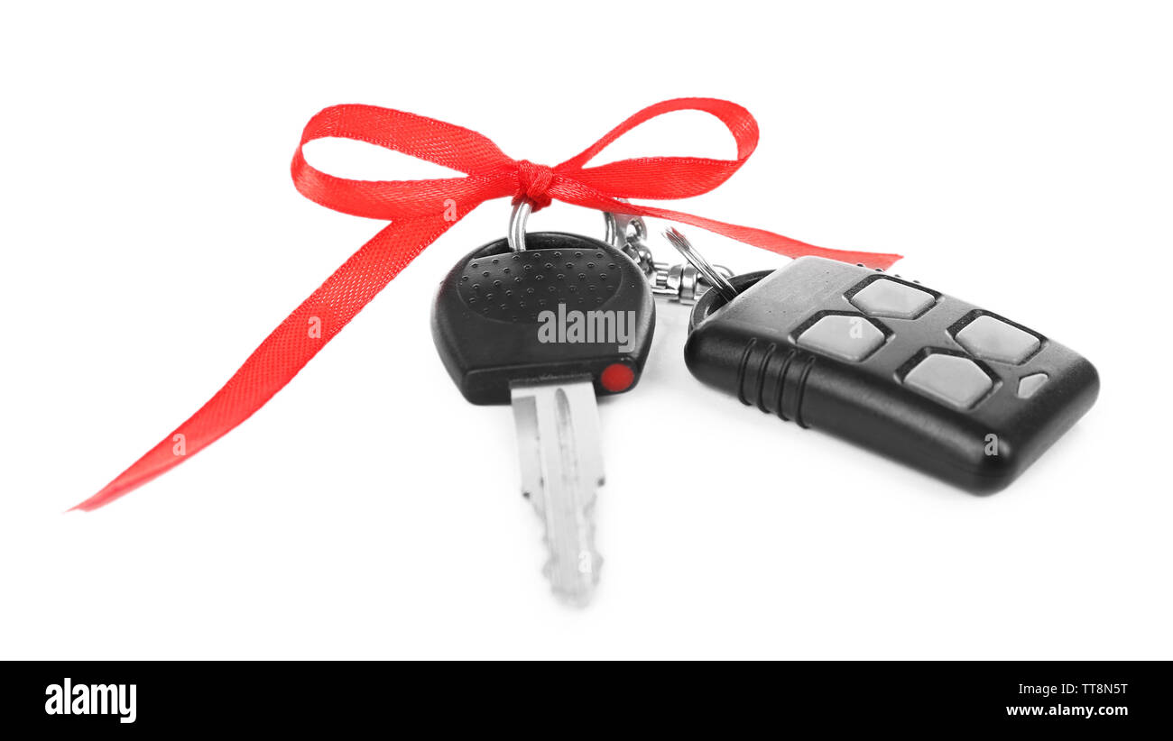 Car keys with red bow as present isolated on white Stock Photo - Alamy