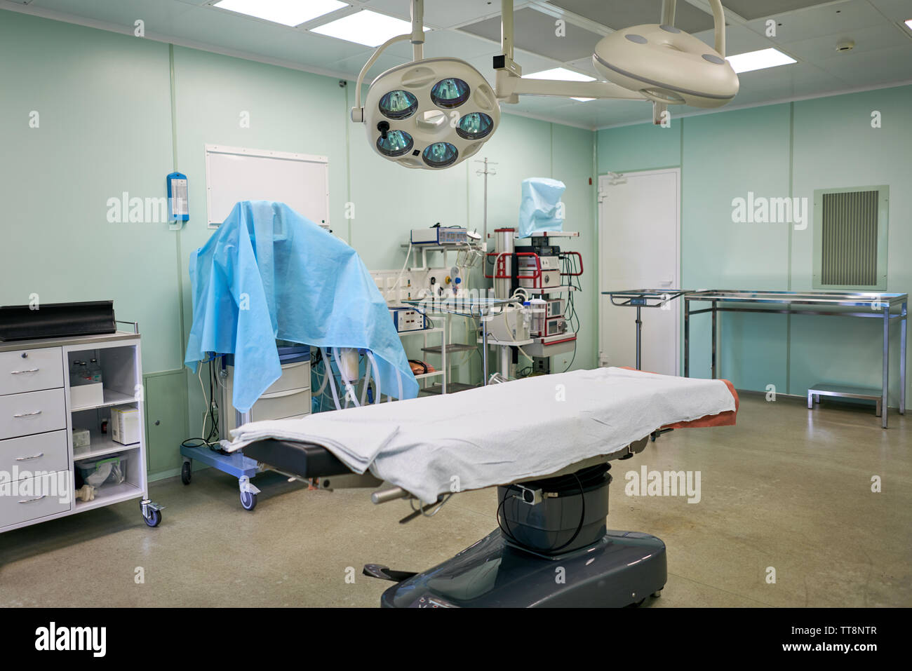 lamp above the operating table in an empty room Stock Photo - Alamy