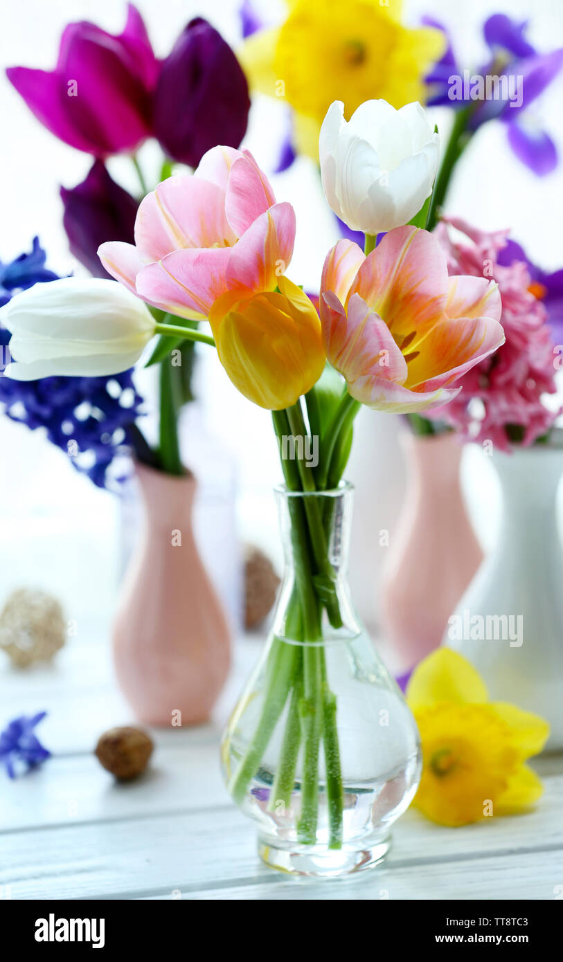 Beautiful bouquets of spring flowers on windowsill background Stock ...