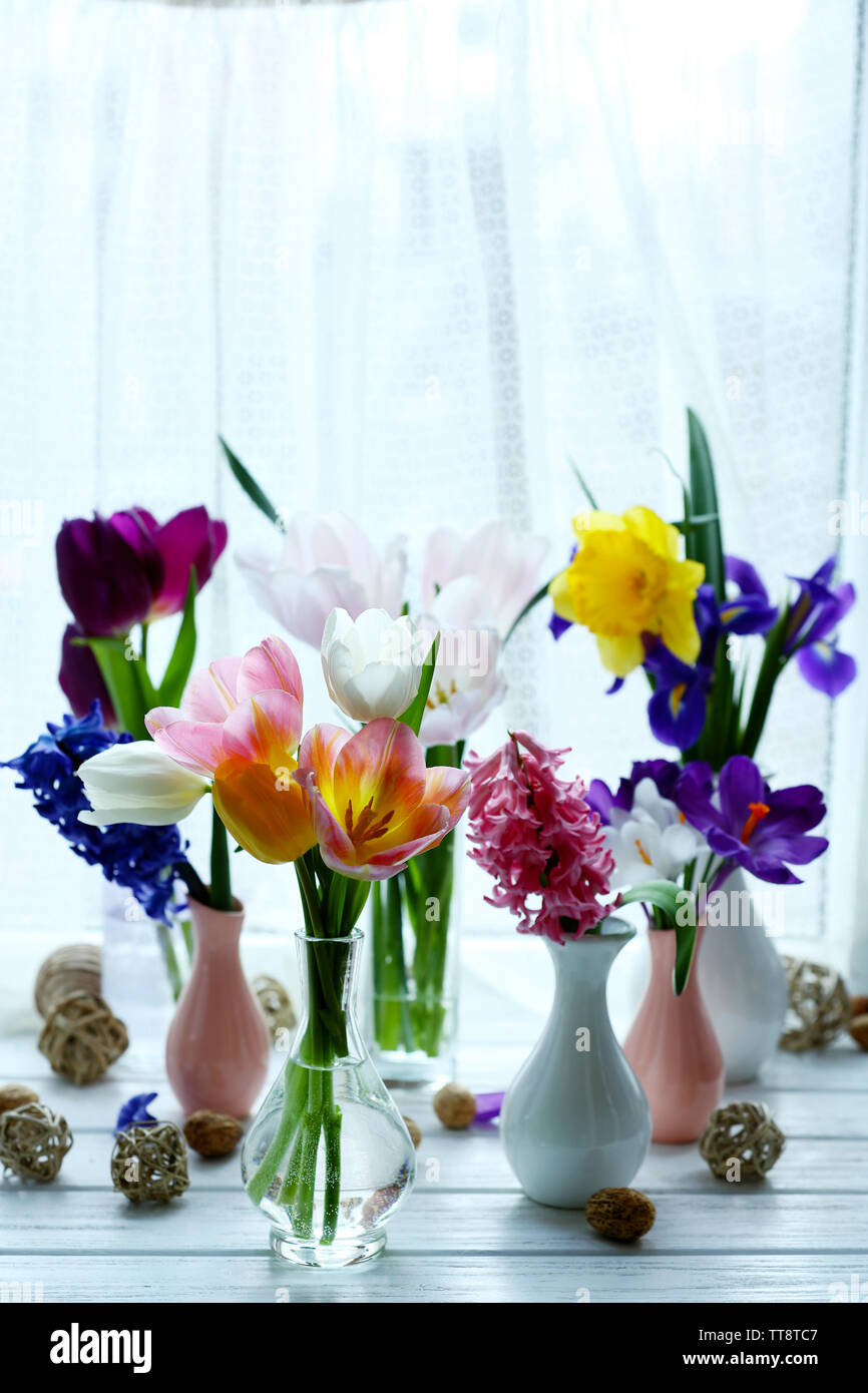 Beautiful bouquets of spring flowers on windowsill background Stock ...
