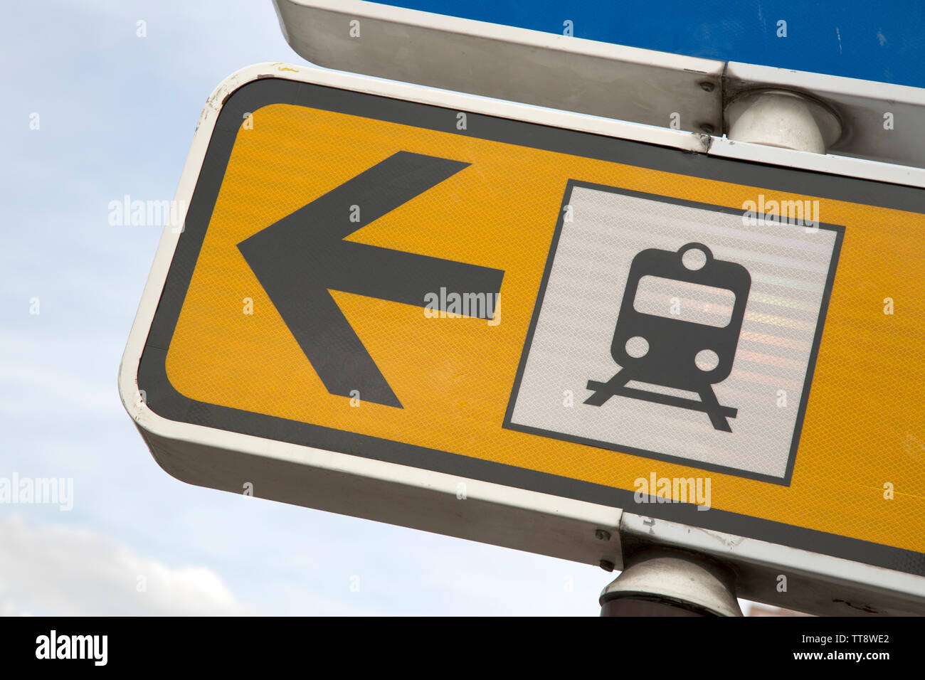 Yellow Railroad Station Sign and Arrow Stock Photo - Alamy