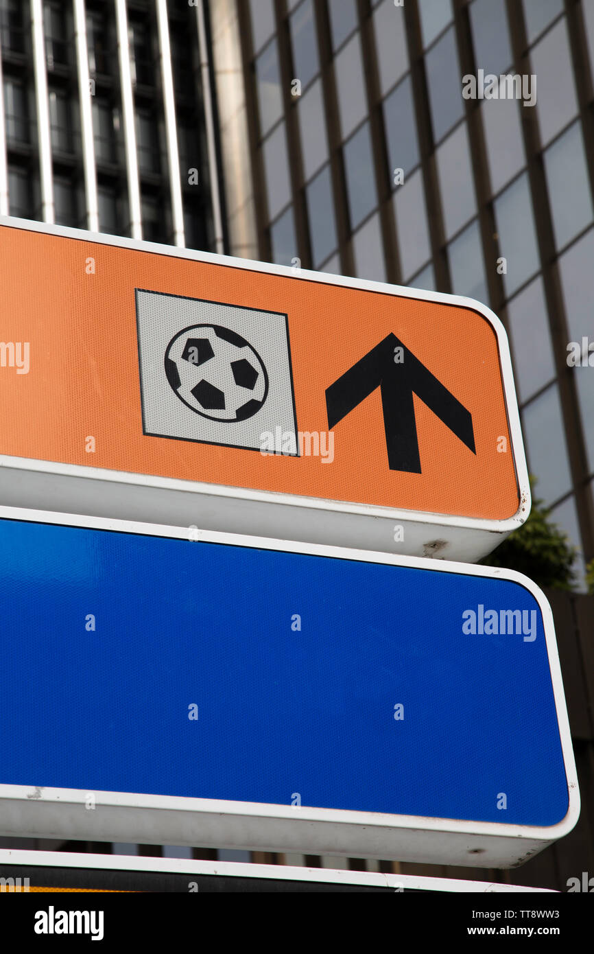 Orange and Blue Football Sign with Arrow Stock Photo - Alamy