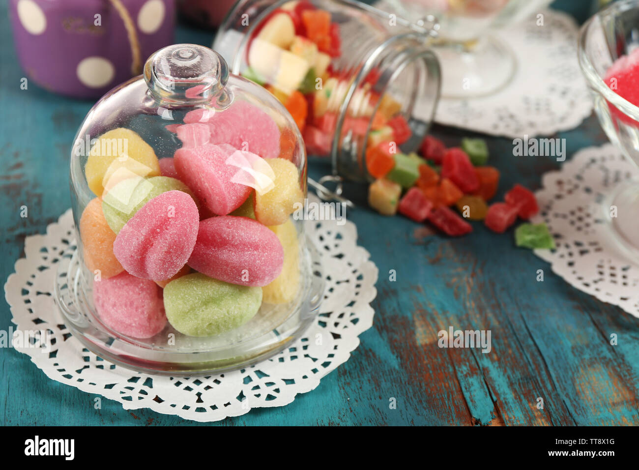 Sweet candies on wooden table, closeup Stock Photo - Alamy