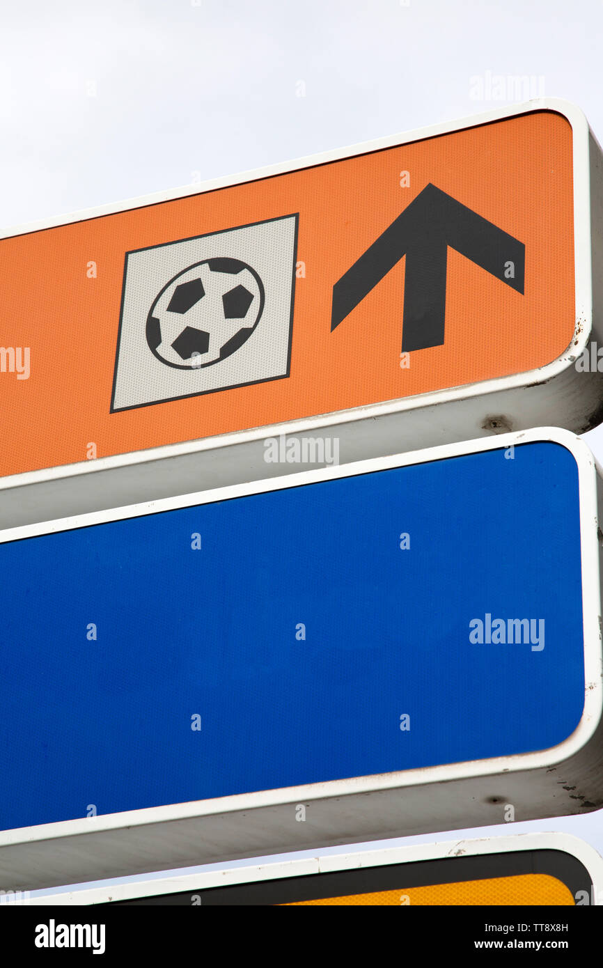 Orange Football Sign with Arrow Stock Photo - Alamy