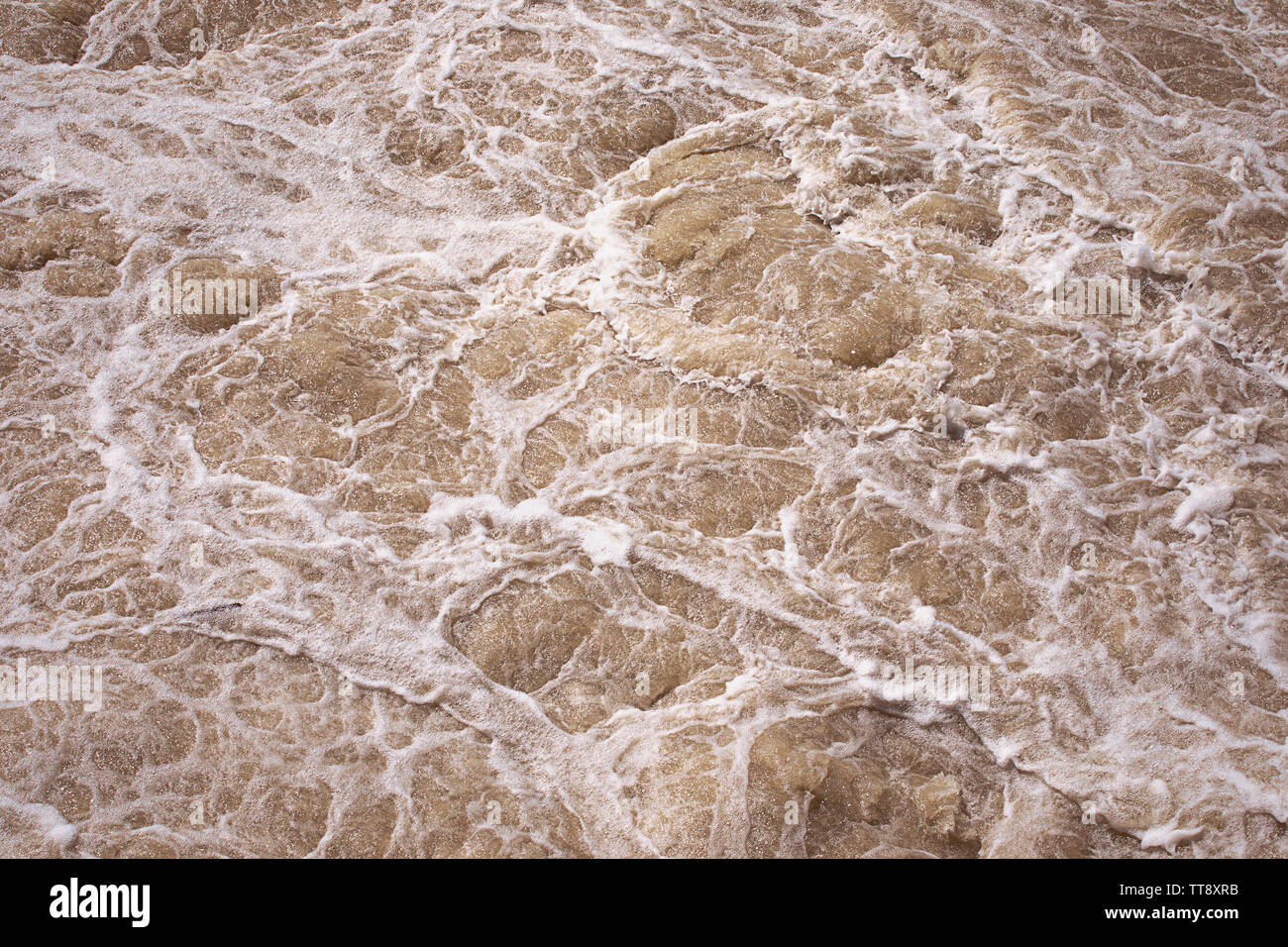 Stormy sea water, rough water surface. Foaming pink water. Foam and ...