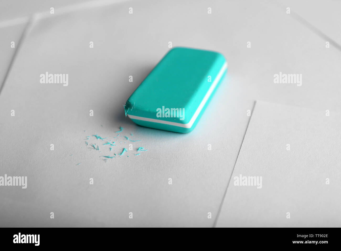 Eraser on paper background Stock Photo - Alamy