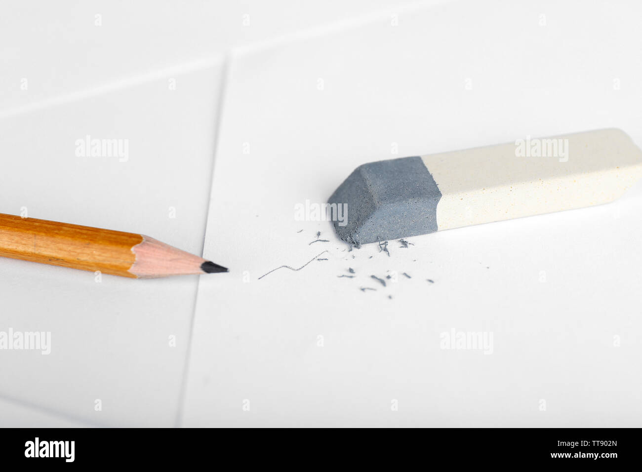 Eraser and pencil on paper background Stock Photo - Alamy