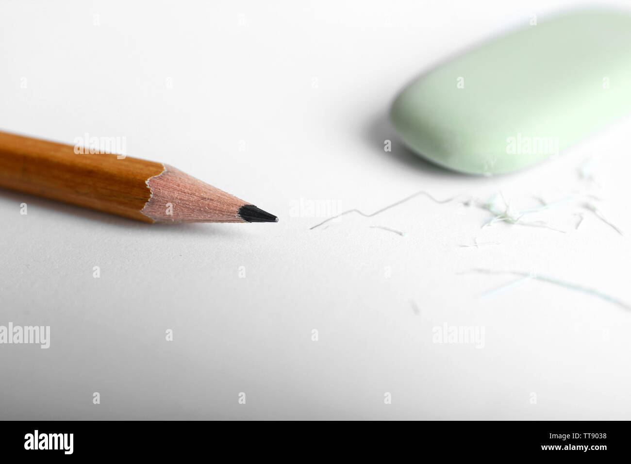 Eraser and pencil on paper background Stock Photo - Alamy