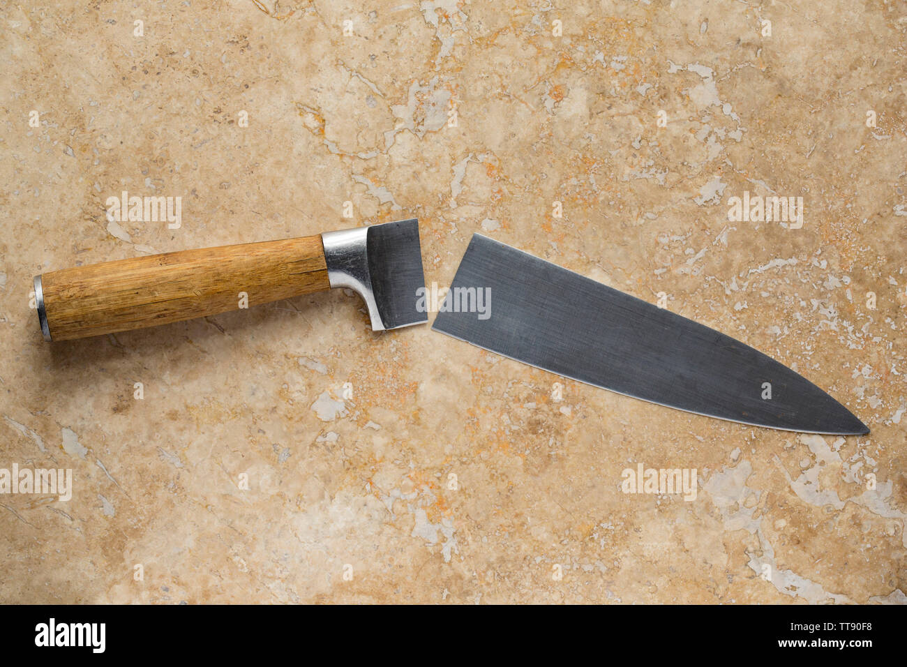 A broken kitchen knife displayed on a light stone background. England UK GB Stock Photo - Alamy