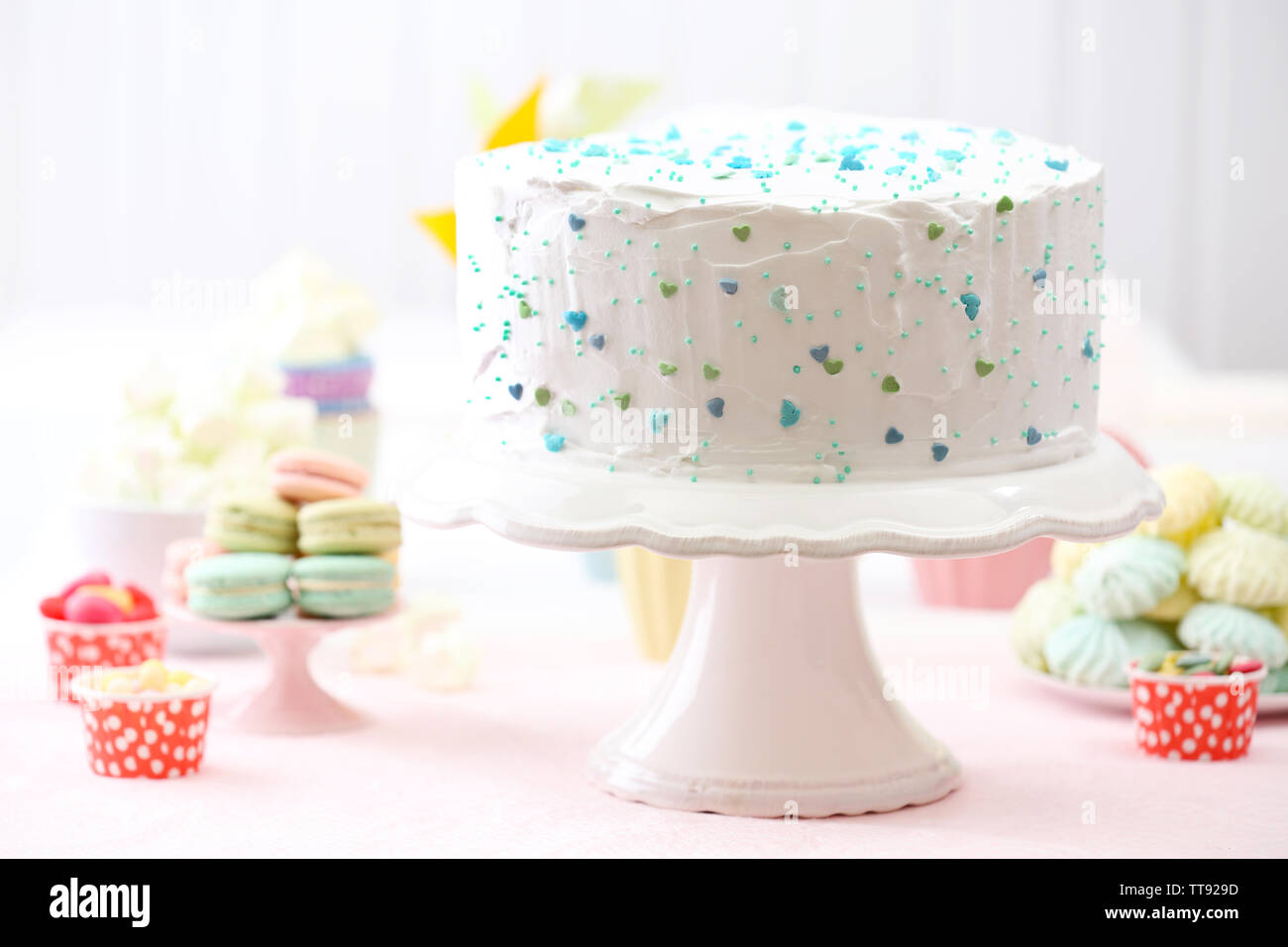 Birthday decorated cake on white wall background Stock Photo - Alamy