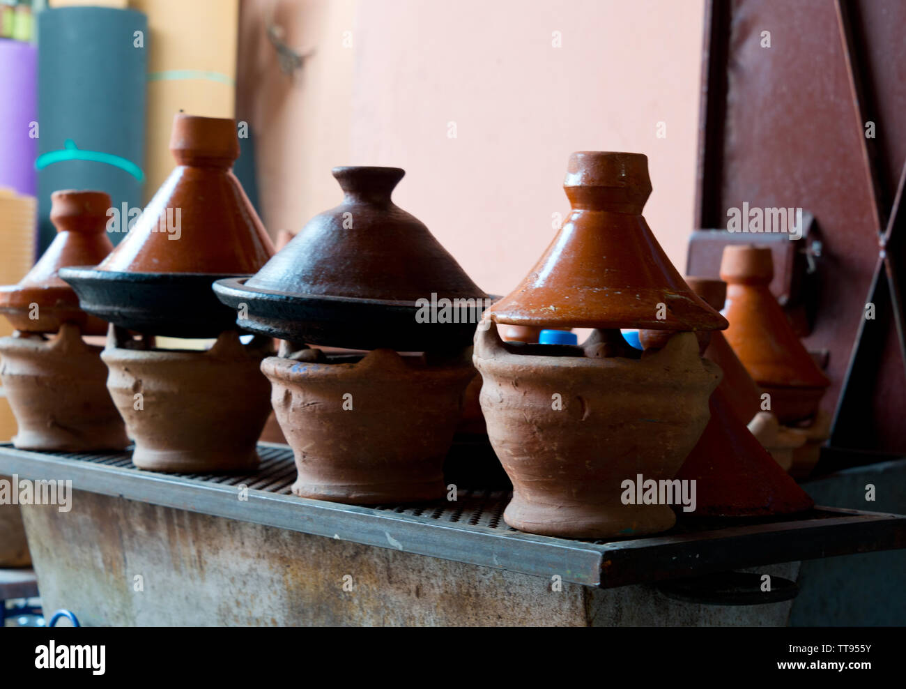 cooking in traditional moroccan tajine pot over open fire Stock Photo ...