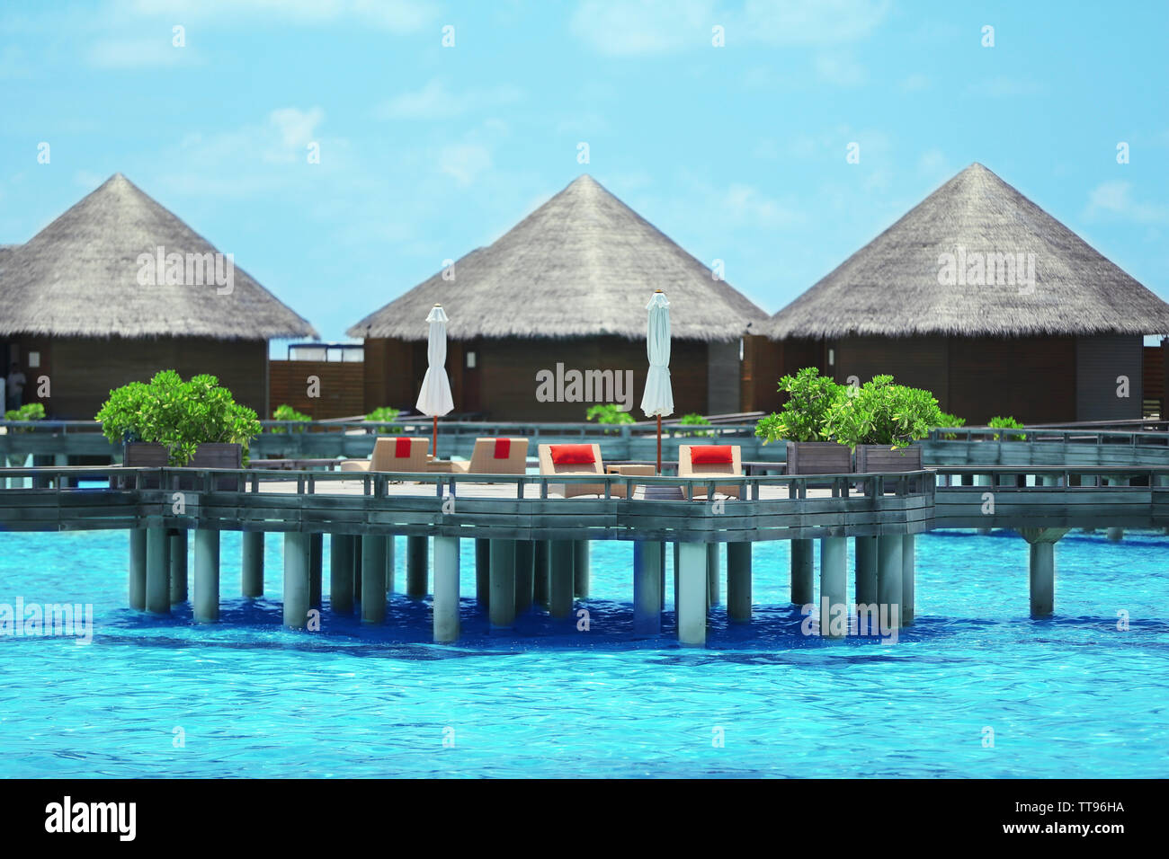 Water villas over ocean background Stock Photo - Alamy