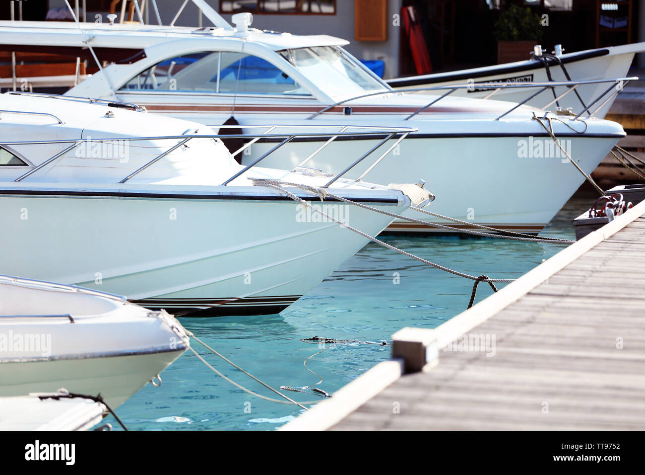 Yacht berth in ocean water in resort Stock Photo - Alamy