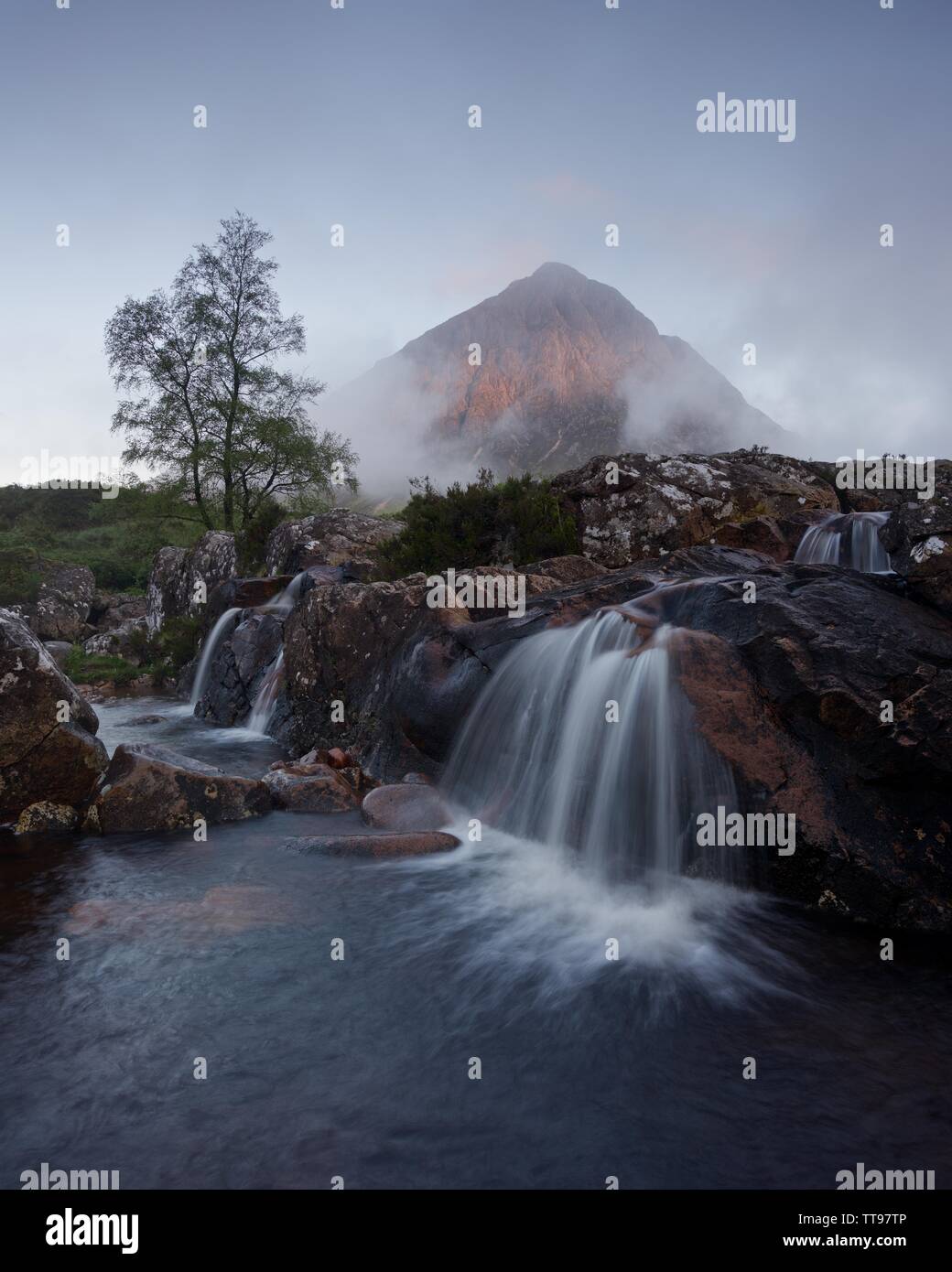 A misty summers sunrise at the Coupall falls in Glencoe Stock Photo - Alamy