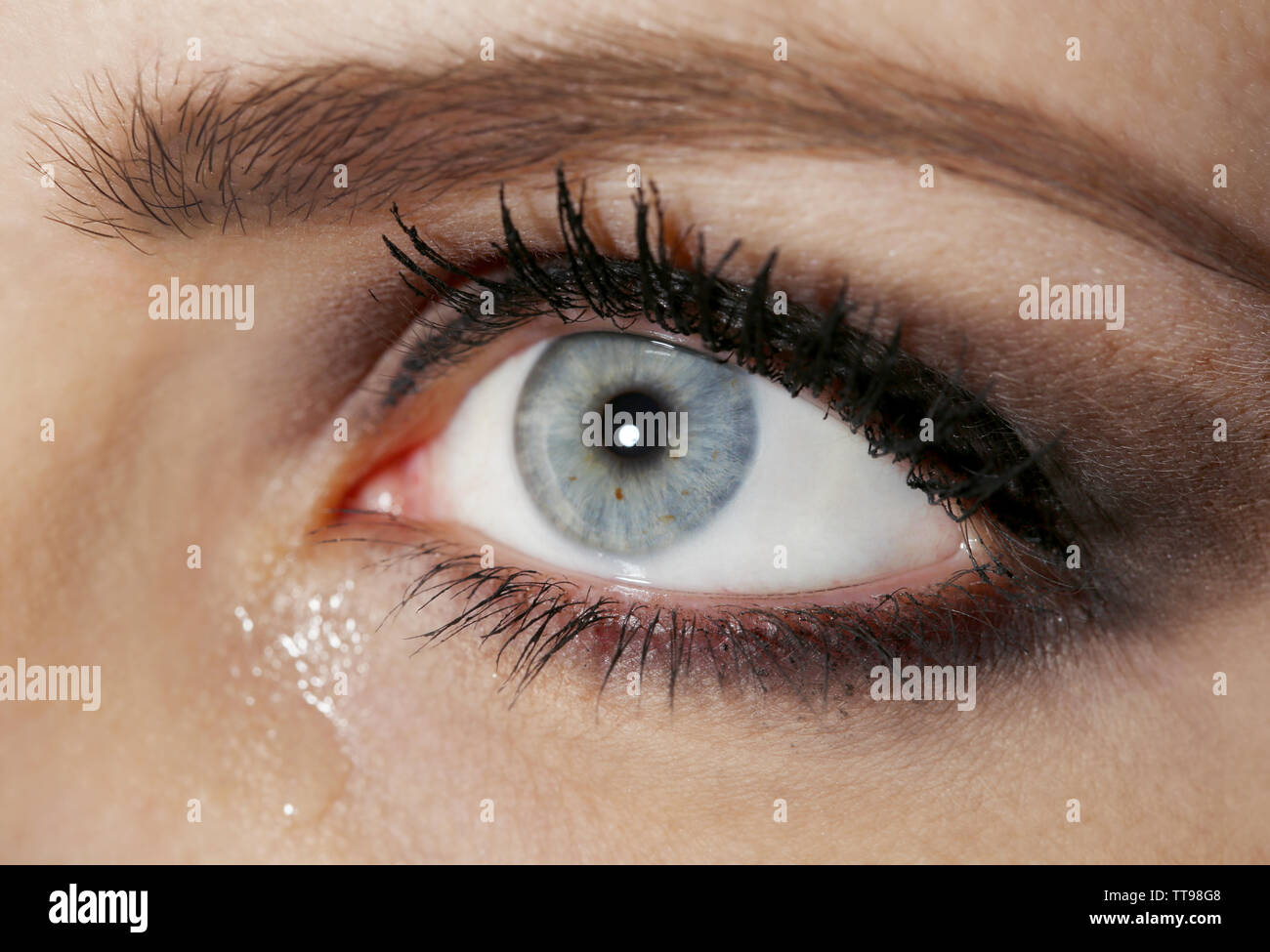 Close up of teary eye hi-res stock photography and images - Alamy