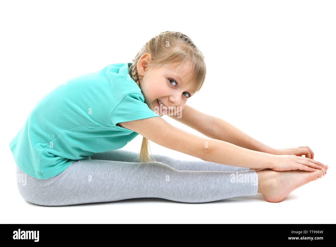 Little girl doing exercises isolated on white Stock Photo - Alamy