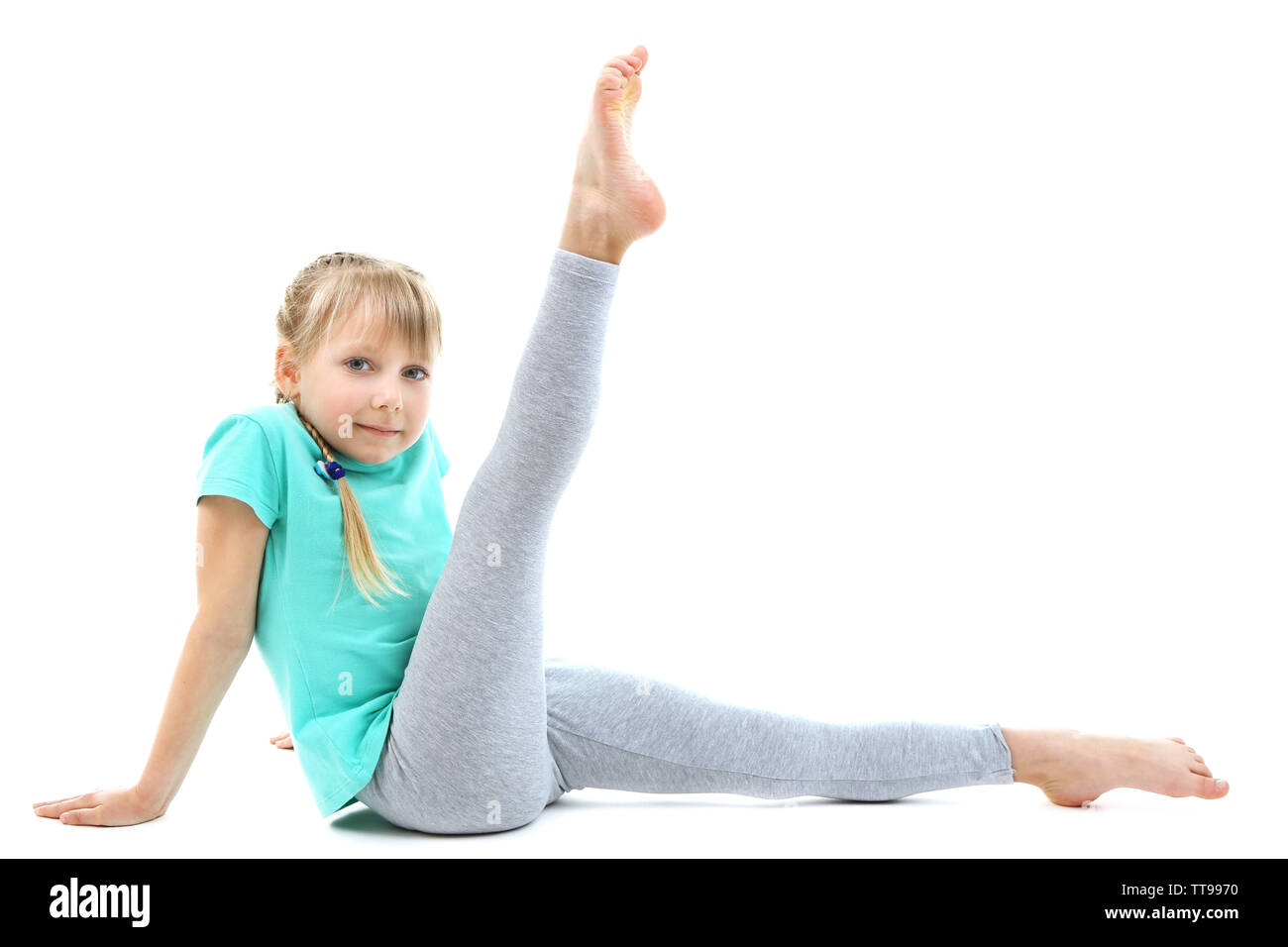 Little girl doing exercises isolated on white Stock Photo - Alamy