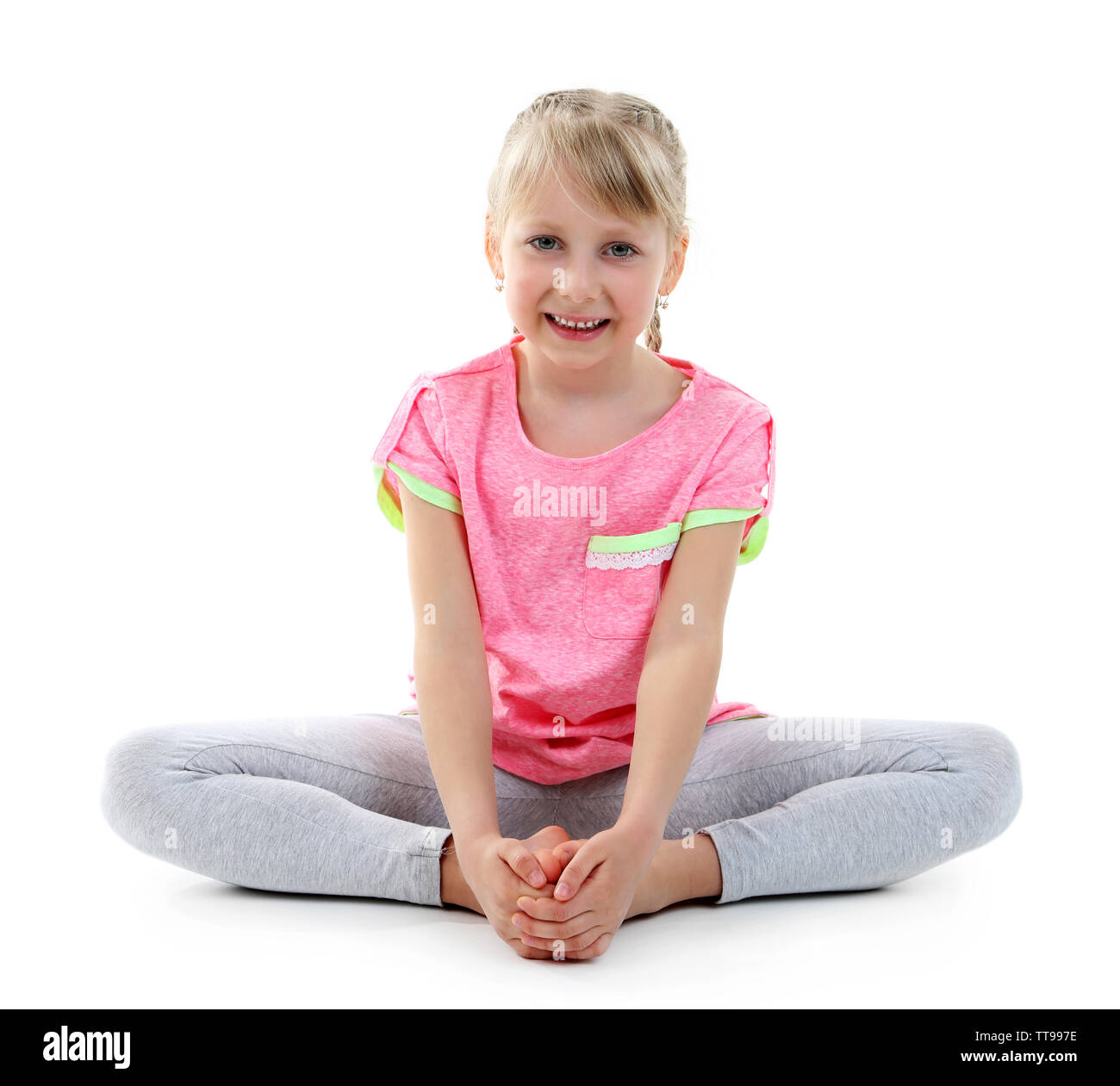 Little girl doing exercises isolated on white Stock Photo - Alamy