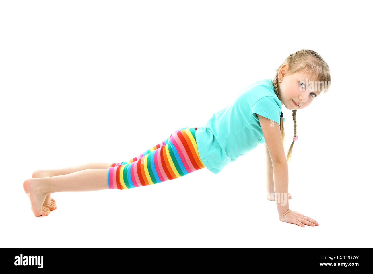 Little girl doing exercises isolated on white Stock Photo - Alamy