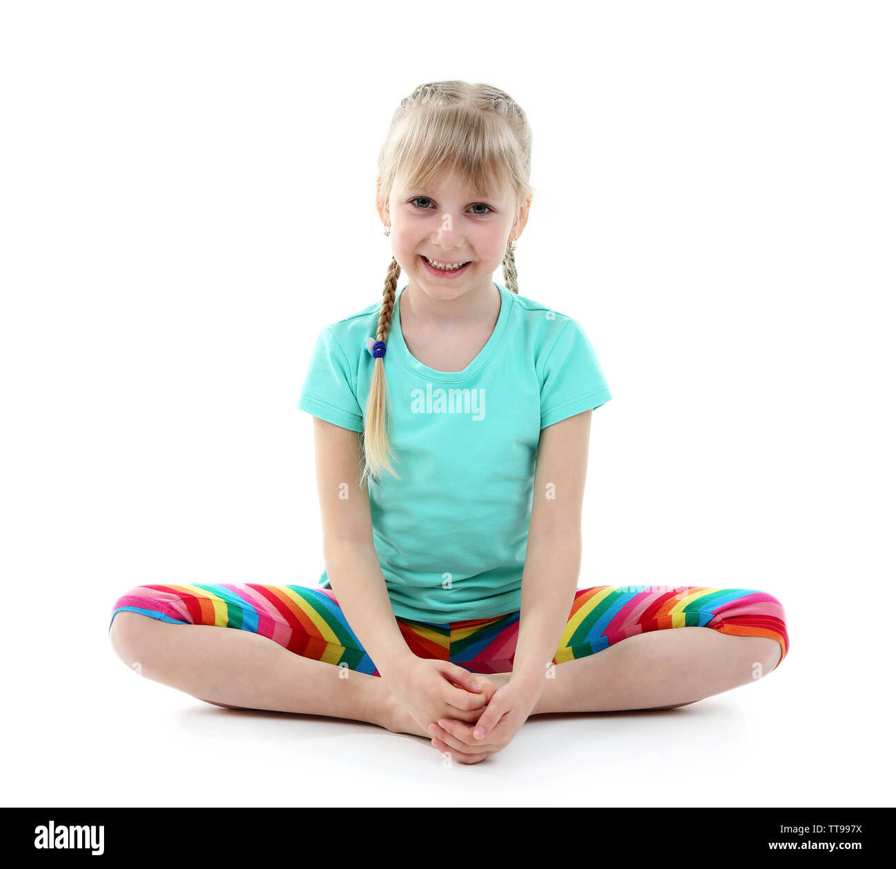 Little girl doing exercises isolated on white Stock Photo - Alamy
