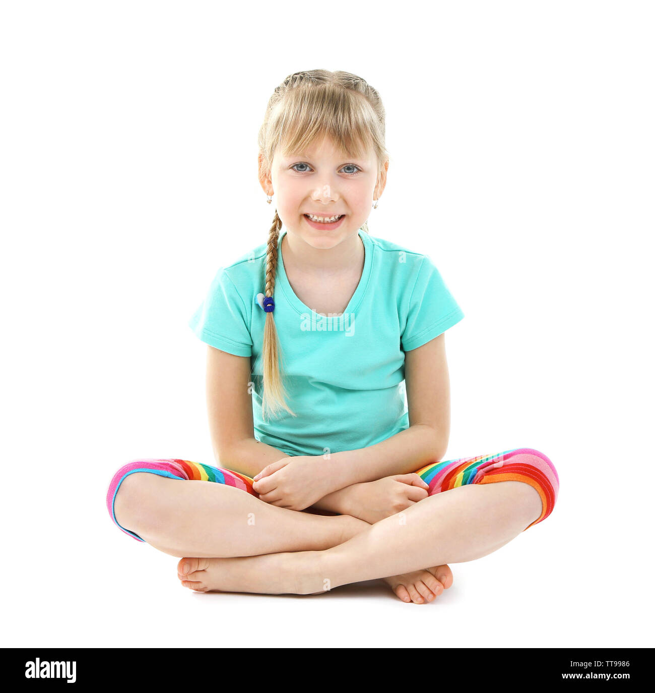 Little girl doing exercises isolated on white Stock Photo - Alamy