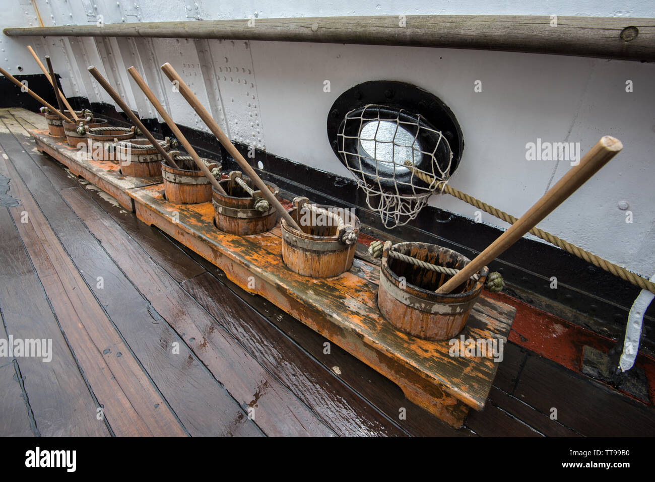 Deck scrubbing Glenlee tall ship Stock Photo - Alamy