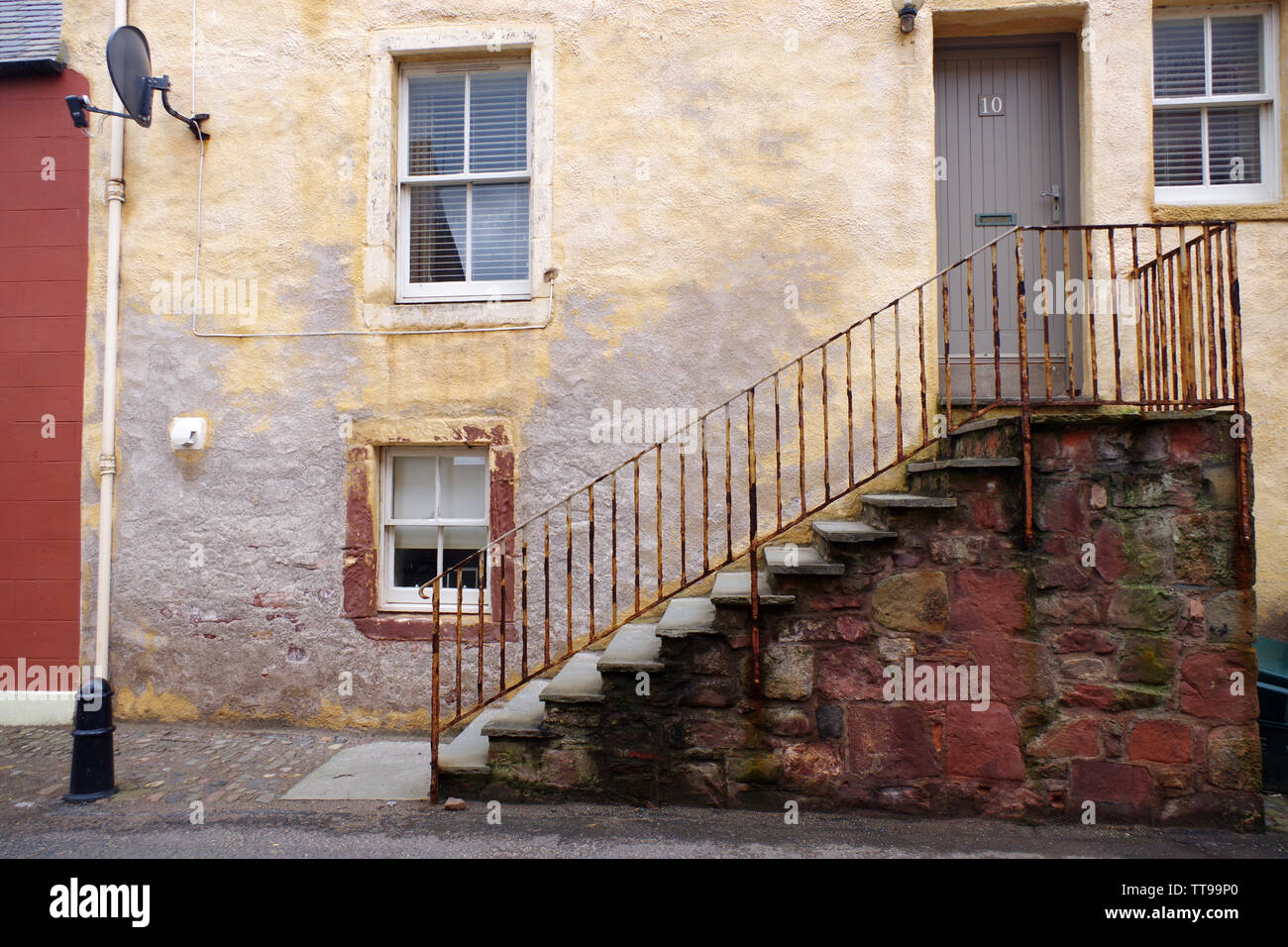 old houses in Dunbar with steps up to the front doors. Dunbar is in ...