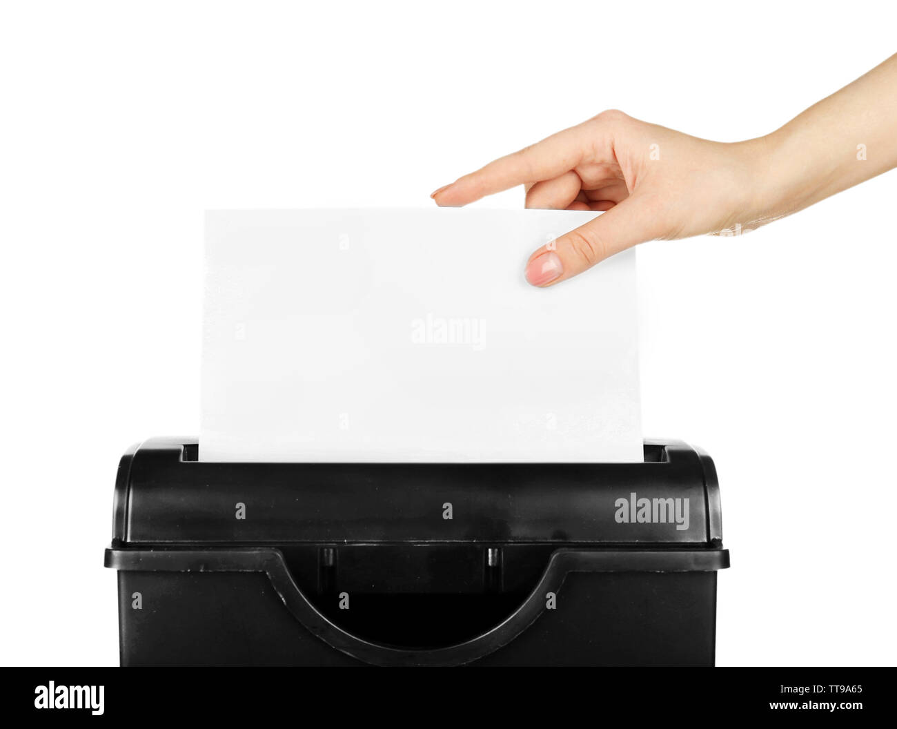 Female hand destroying sheet of paper with shredder isolated on white ...