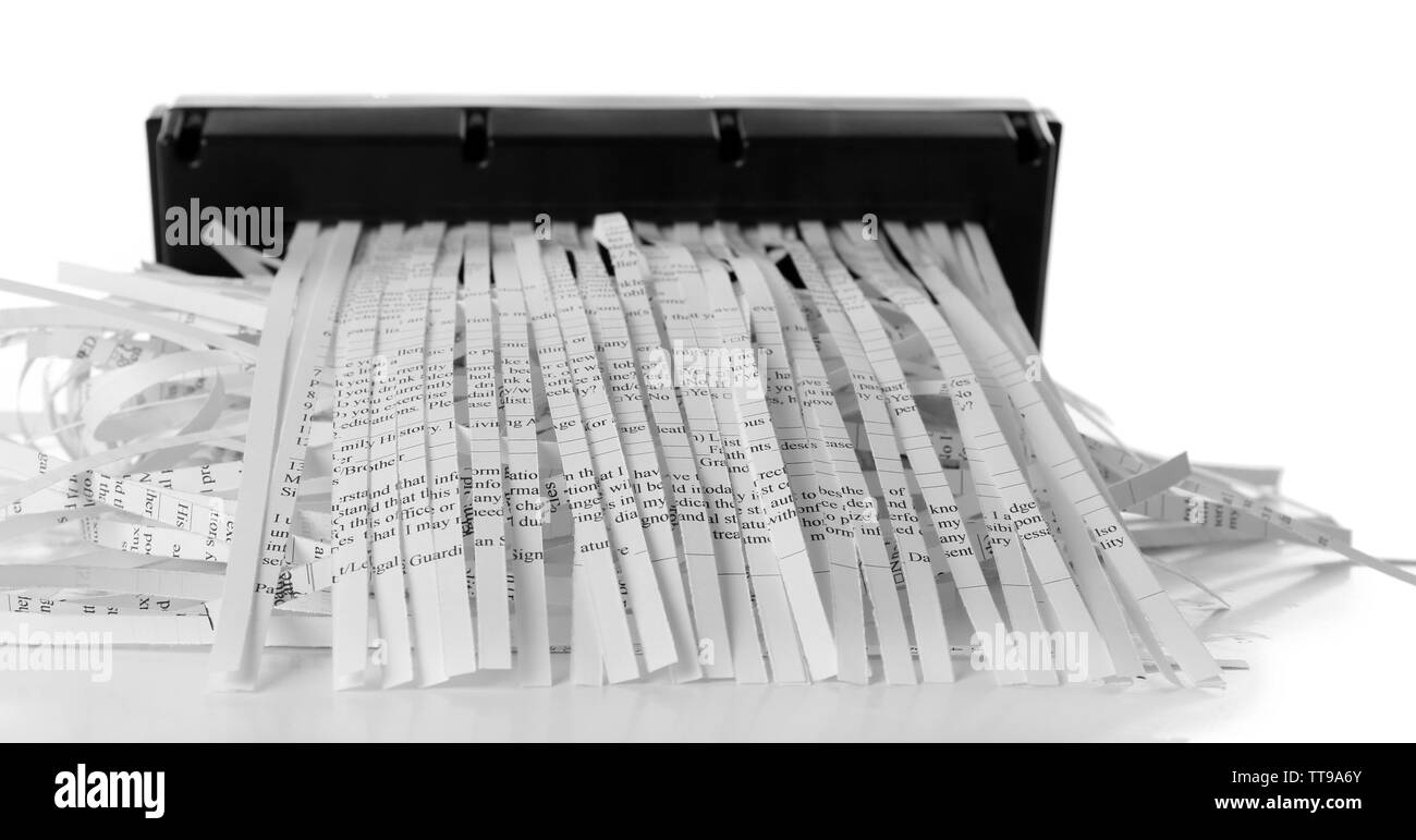 Strips of destroyed paper from shredder isolated on white Stock Photo ...