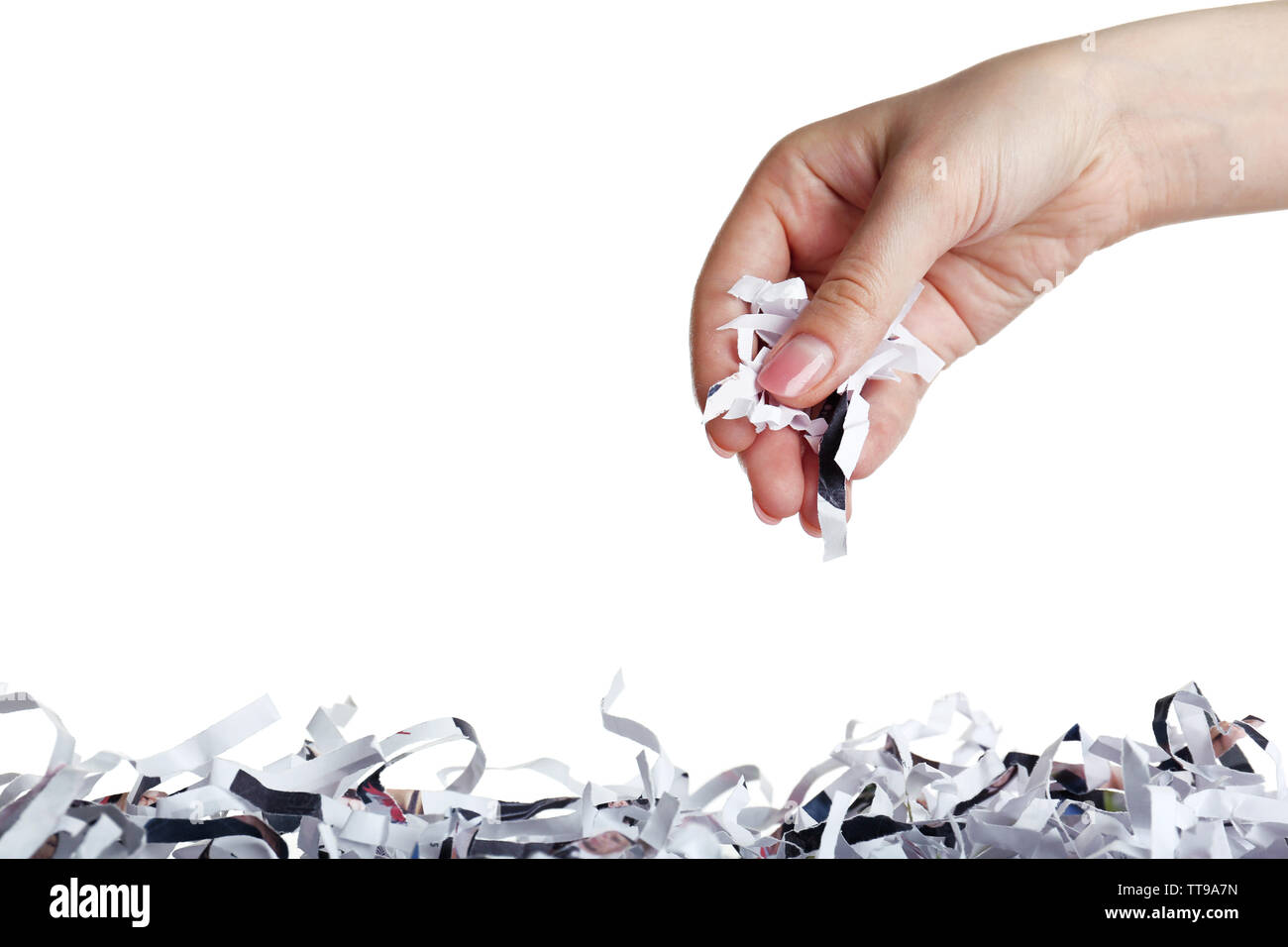 Strips of destroyed paper from shredder in female hand isolated on ...