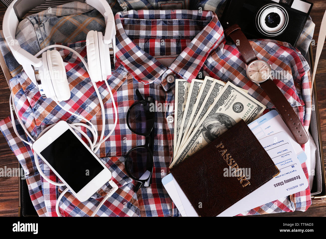 Packed suitcase of vacation items, top view Stock Photo - Alamy