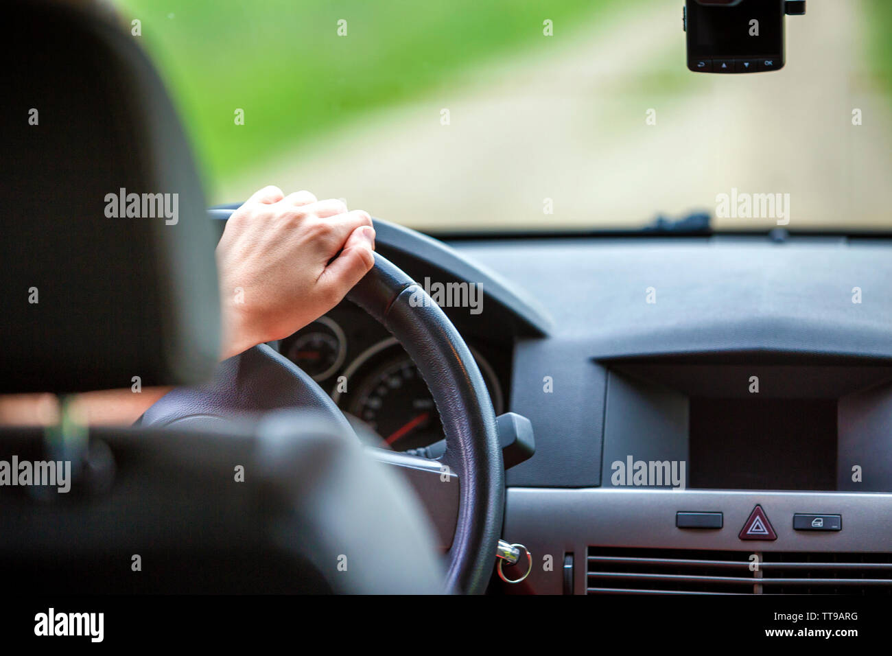 Woman hands on steering wheel driving a car Stock Photo - Alamy