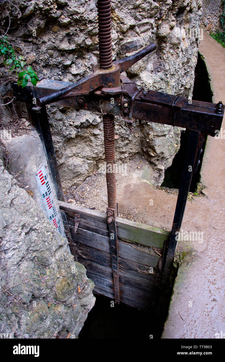 irrigation sluice system with rusty shutoff wheel in ronda, andalusia ...