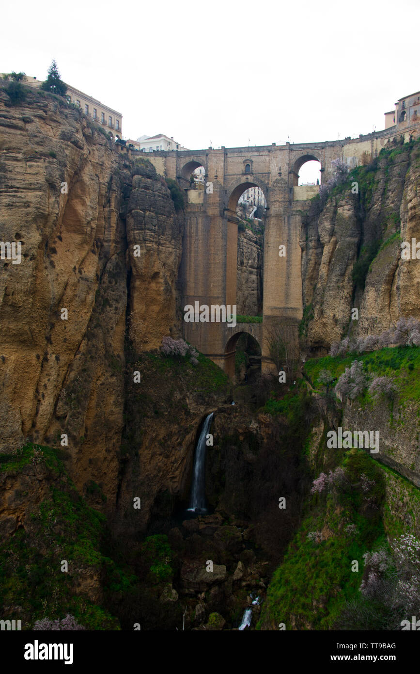 ancient bridge, connecting old and new part of andalusian town ronda ...