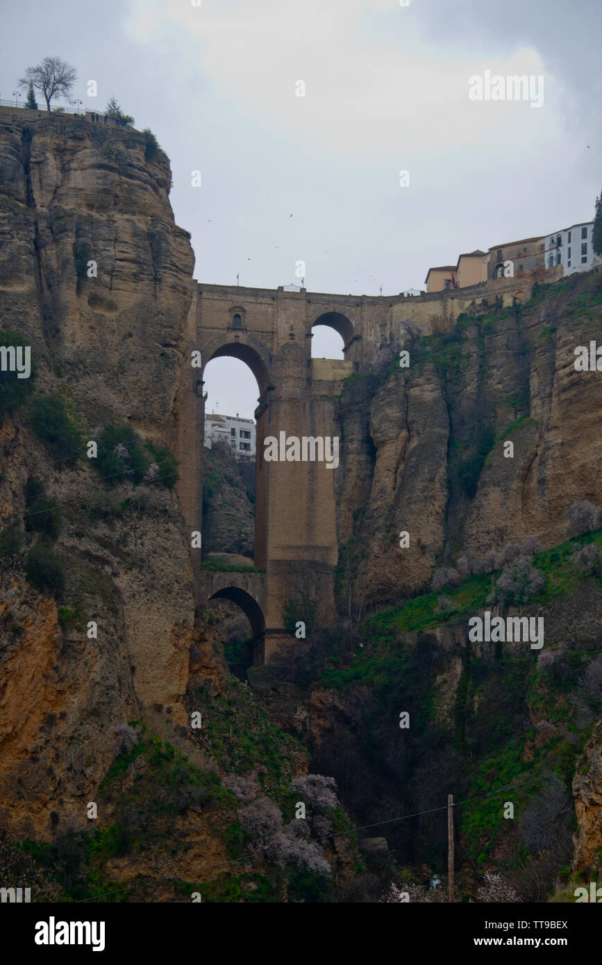 ancient bridge, connecting old and new part of andalusian town ronda ...