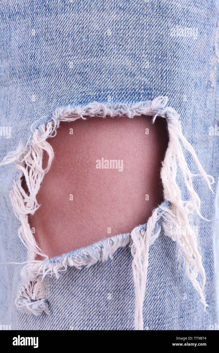 Torn jeans, closeup Stock Photo - Alamy